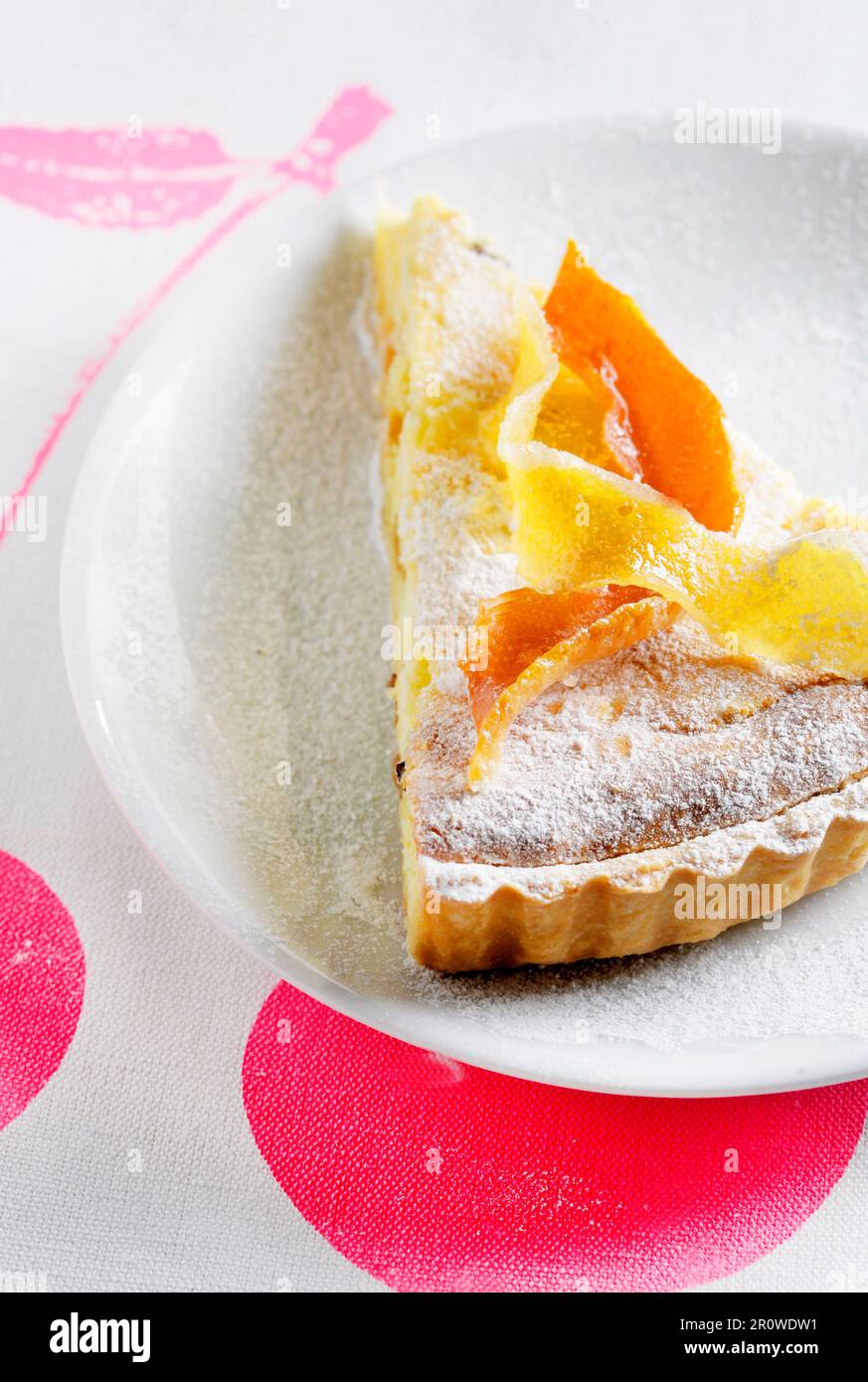 Slice of ricotta,confit orange and lemon rind pie Stock Photo - Alamy