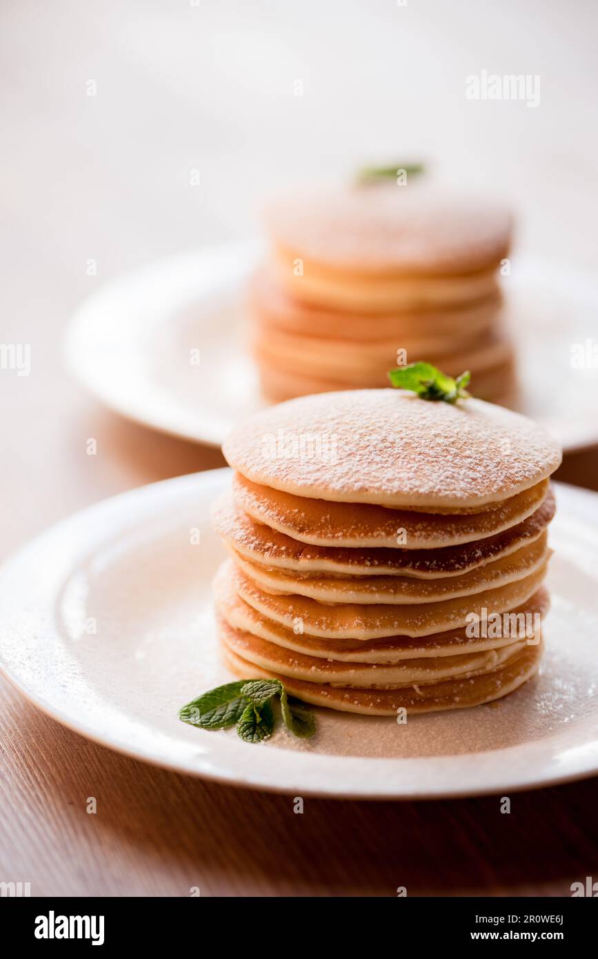 Pancakes with mint and powdered sugar Stock Photo - Alamy