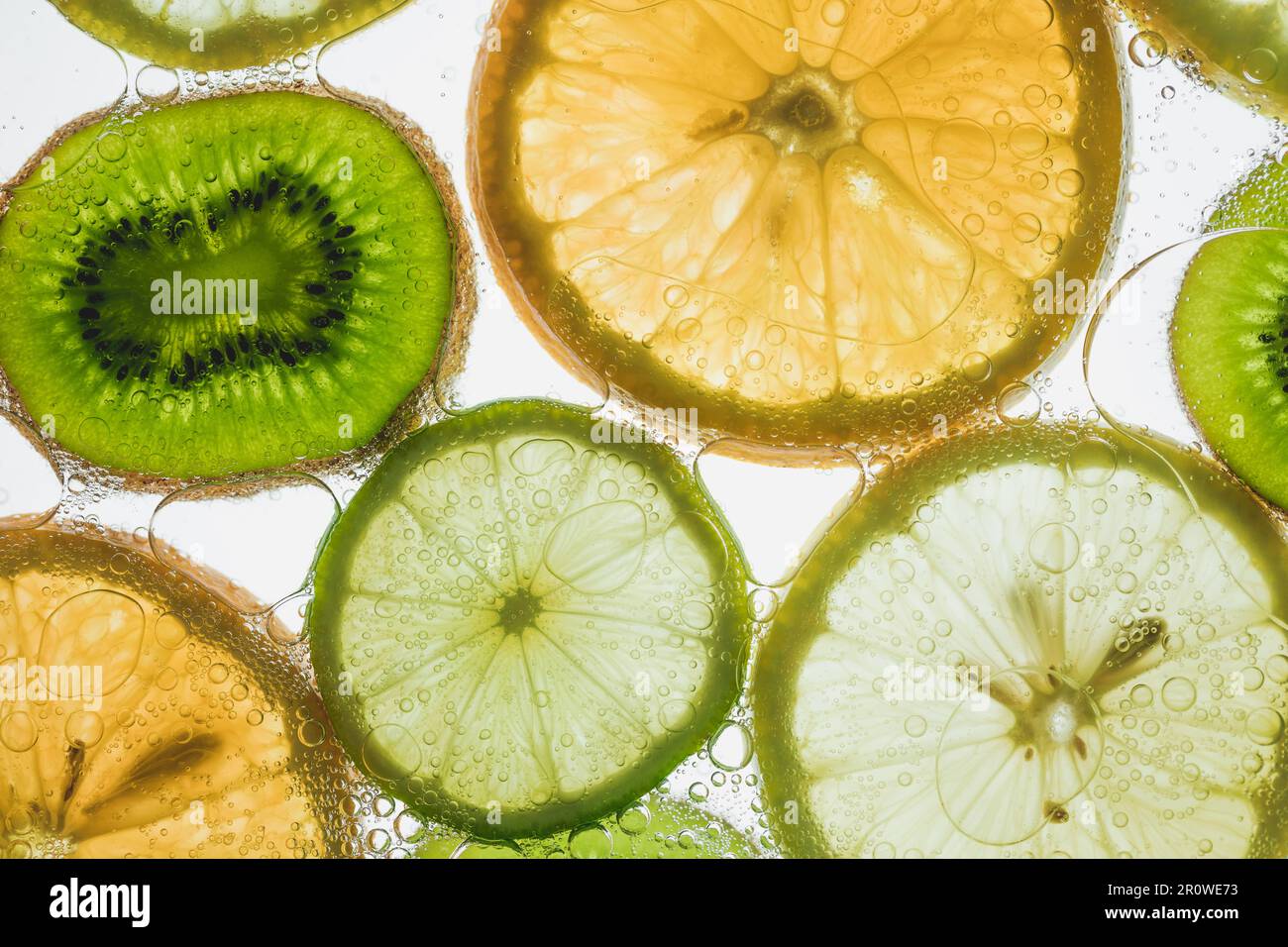 Citrus slices floating in water Stock Photo - Alamy