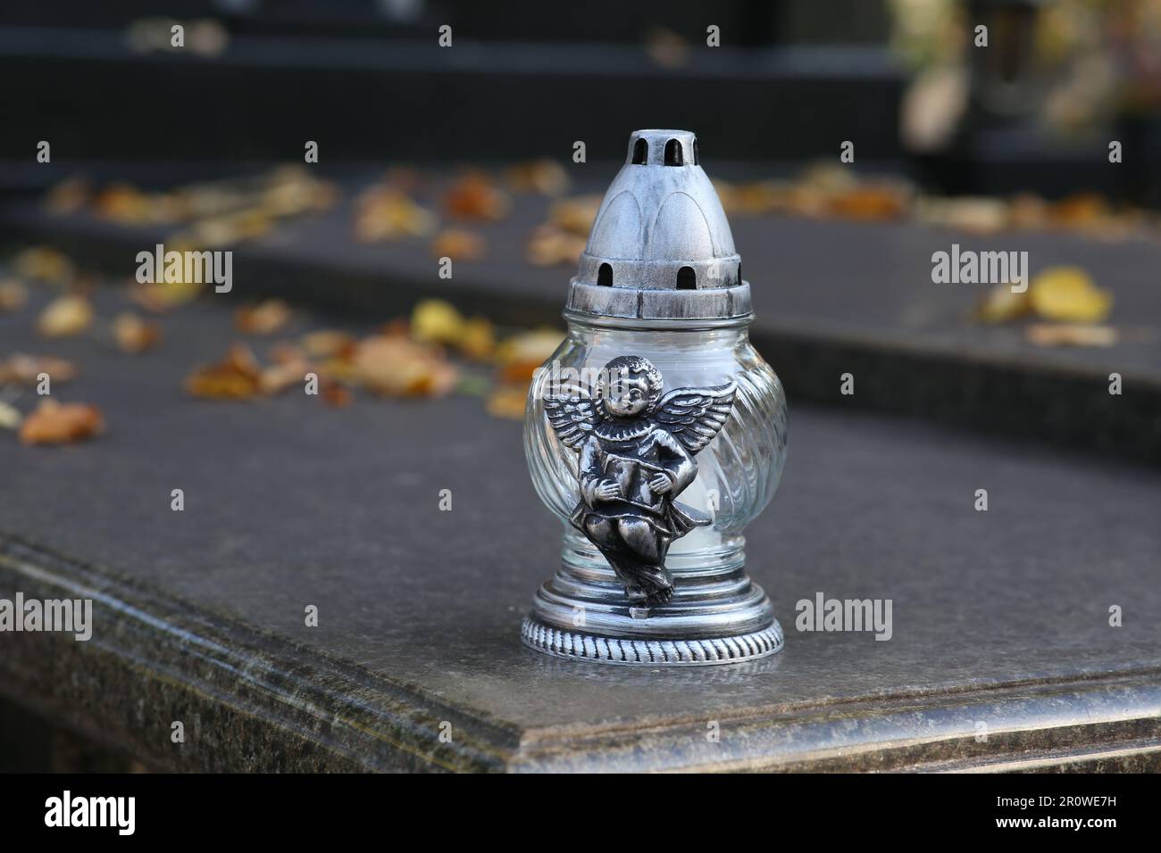 Grave lantern on granite surface in cemetery Stock Photo - Alamy