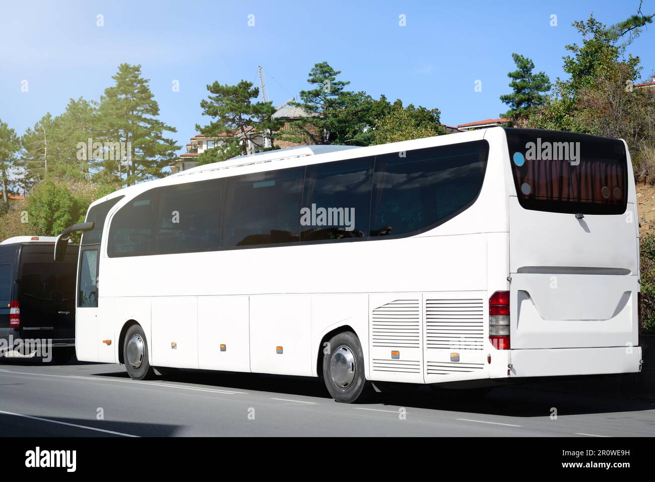Modern white bus on road outdoors. Public transport Stock Photo - Alamy