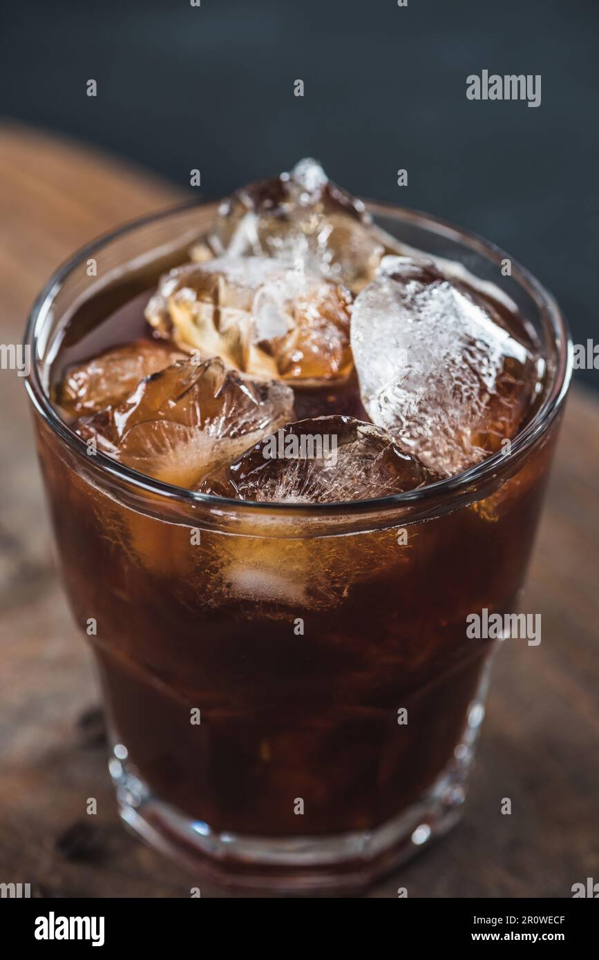Glass of cold brewed coffee with ice cubes Stock Photo - Alamy