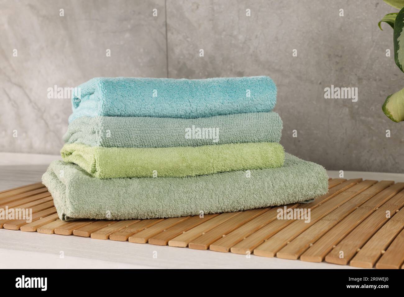 Stack of clean towels on countertop in laundry room Stock Photo - Alamy