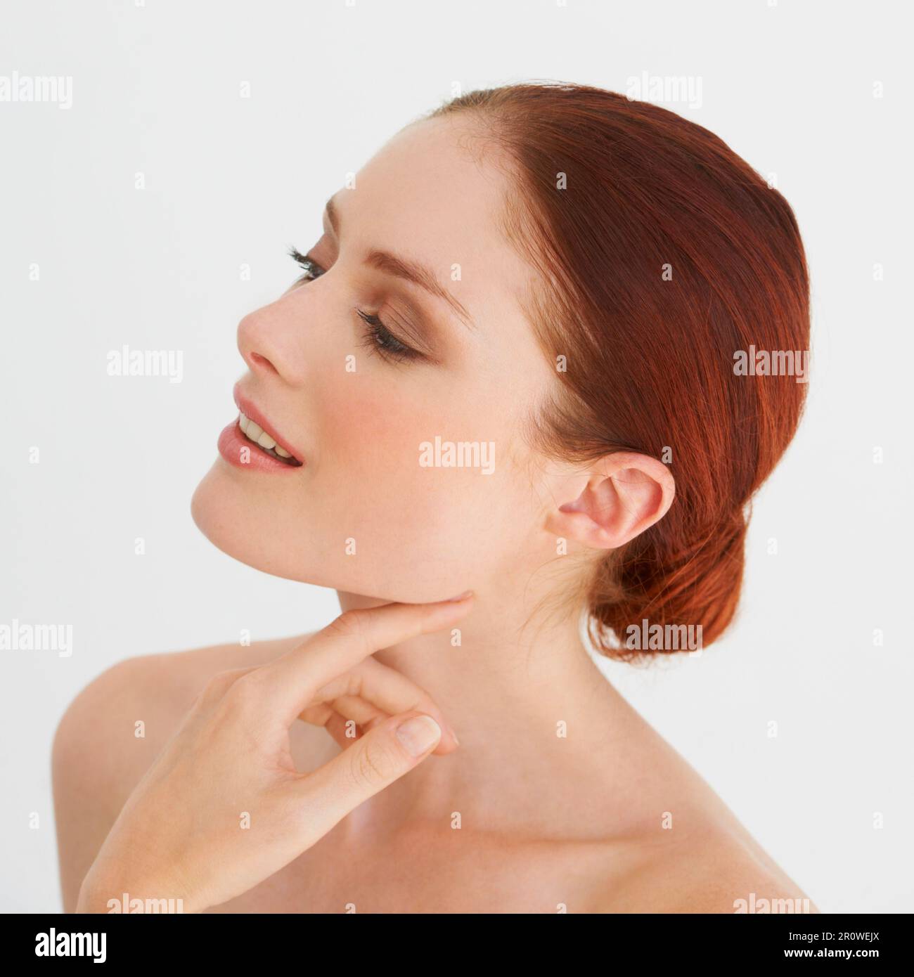 Natural beauty, woman and touch face in white background, studio and ...