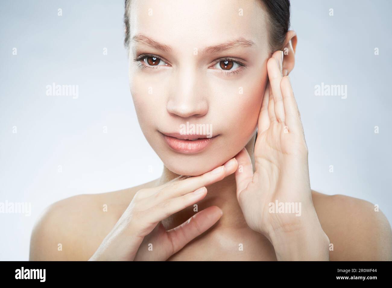 Skincare, beauty and woman with hands on face isolated on studio ...