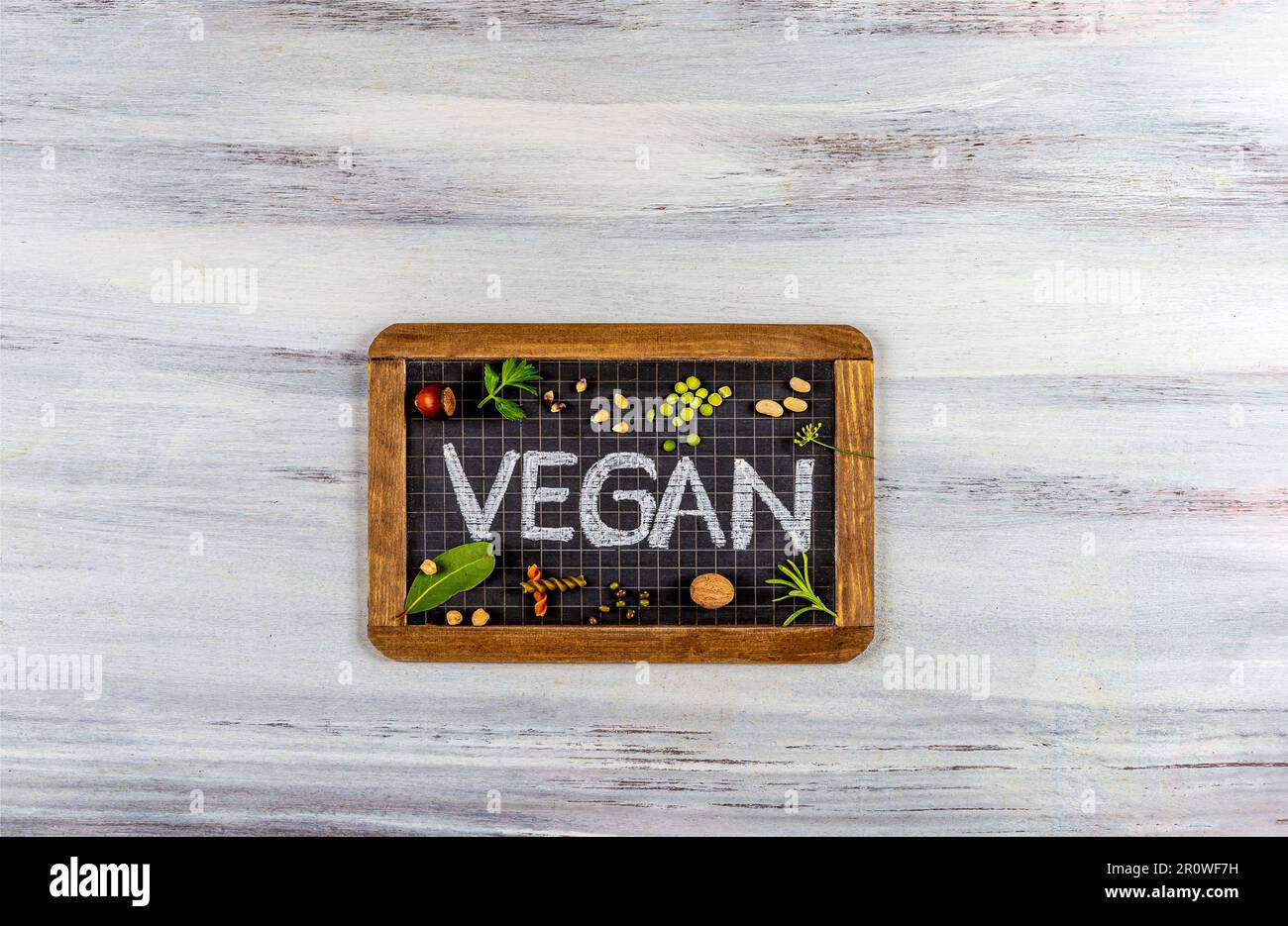 Chalk writing 'vegan' on a school blackboard Stock Photo - Alamy