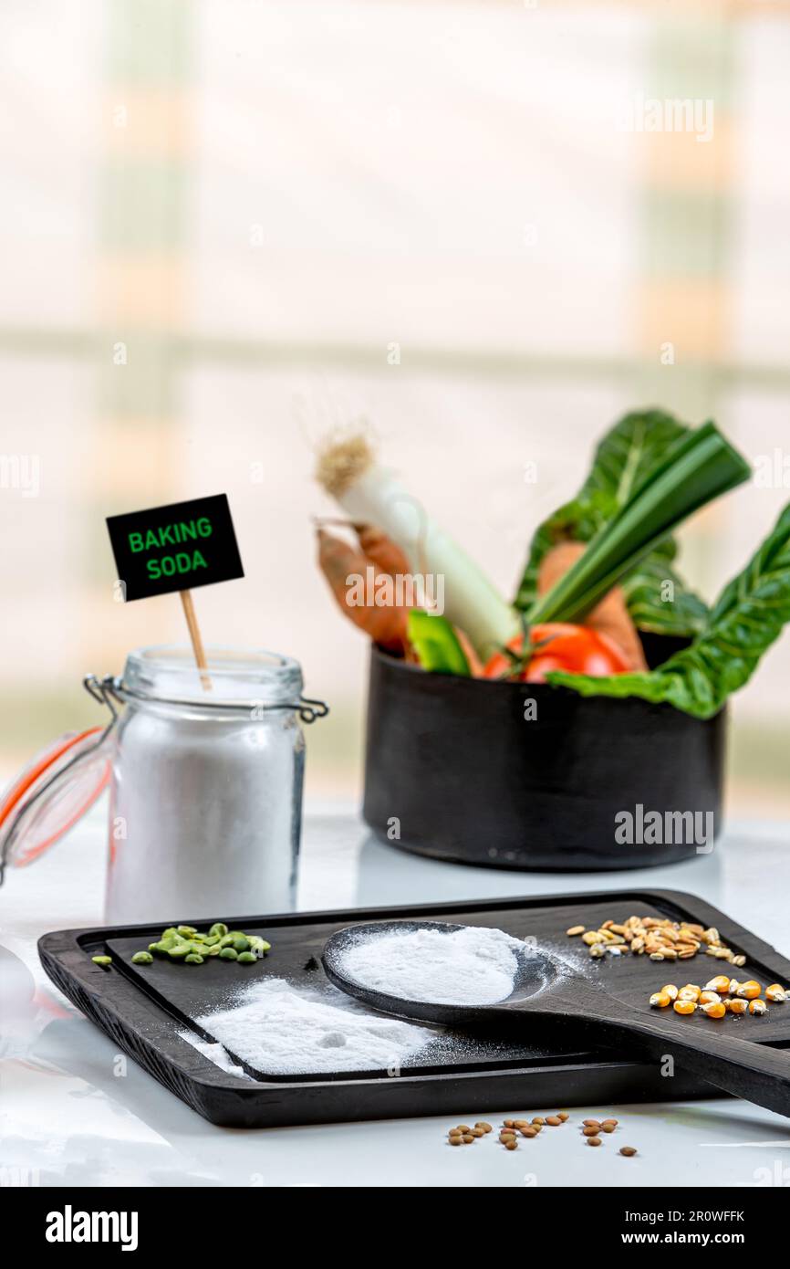 Bicarbonate powder surrounded by fruit, vegetables and cereals Stock ...