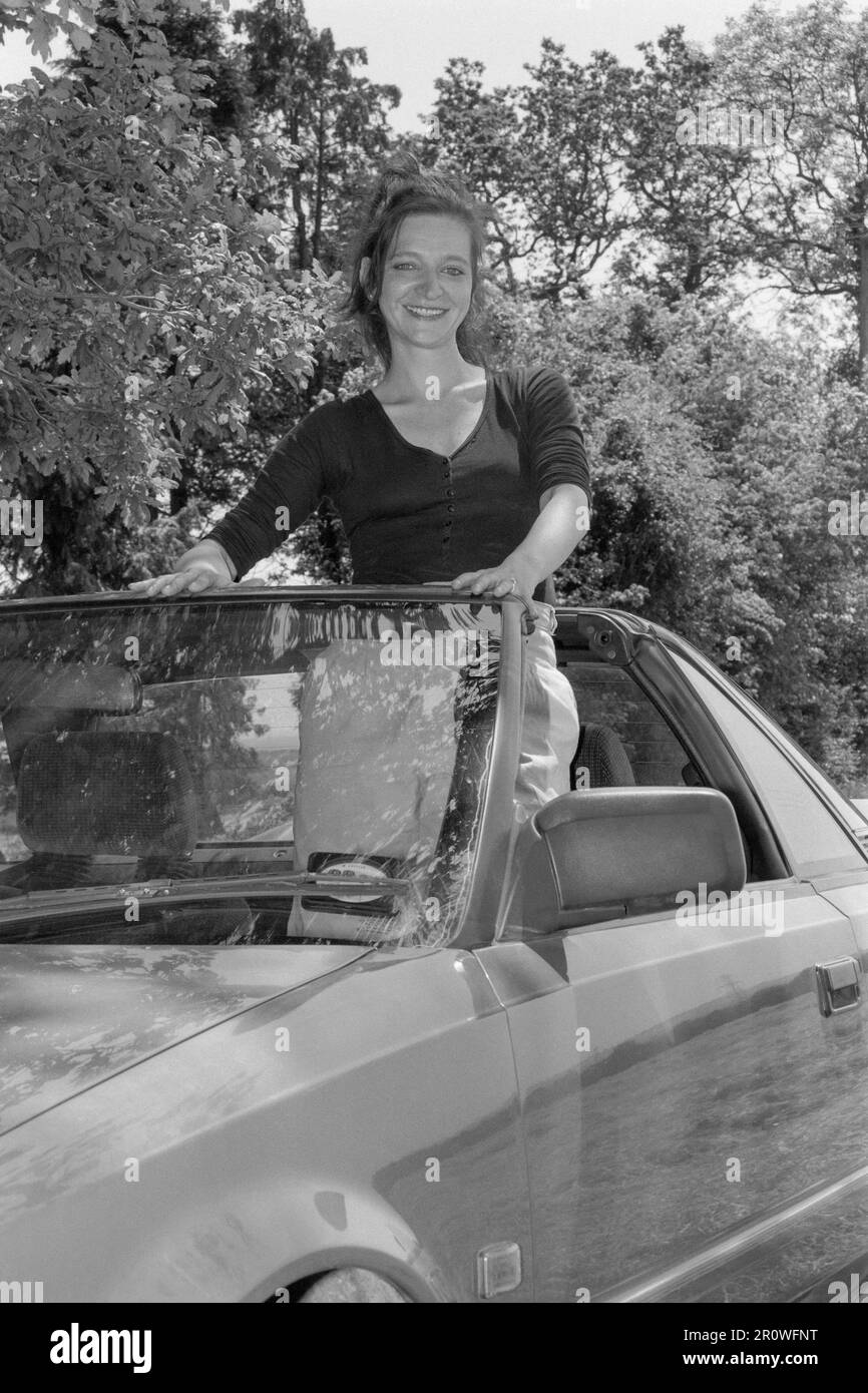 young slim dark haired female posing for portrait with toyoya mr2 mk1 t ...