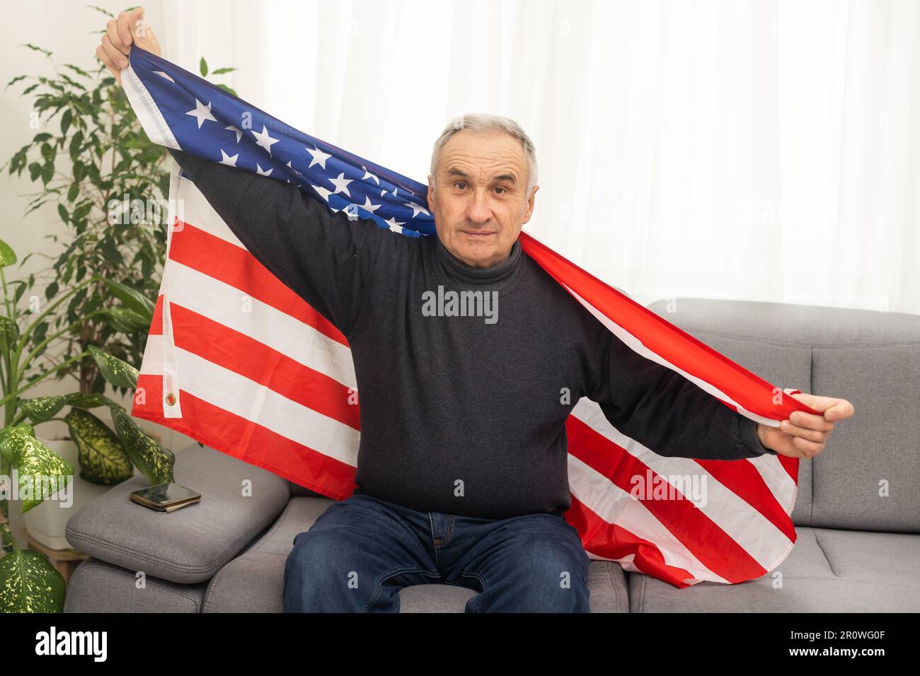 Holding USA flag in hands. Patriotic senior old man and usa flag Stock ...