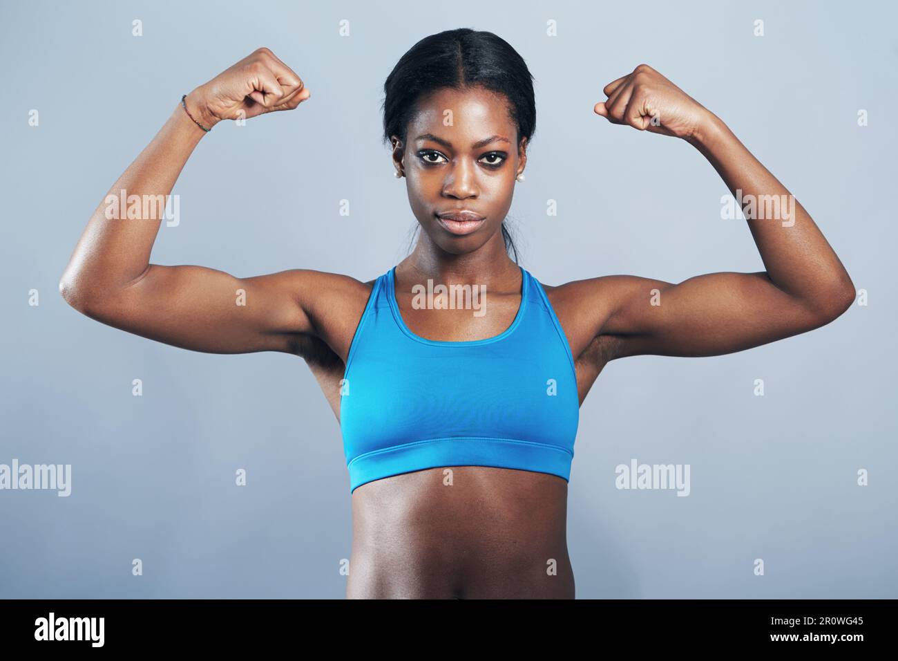 Power Fitness And Portrait Of Black Woman Flexing Arm Muscles For Exercise Motivation And