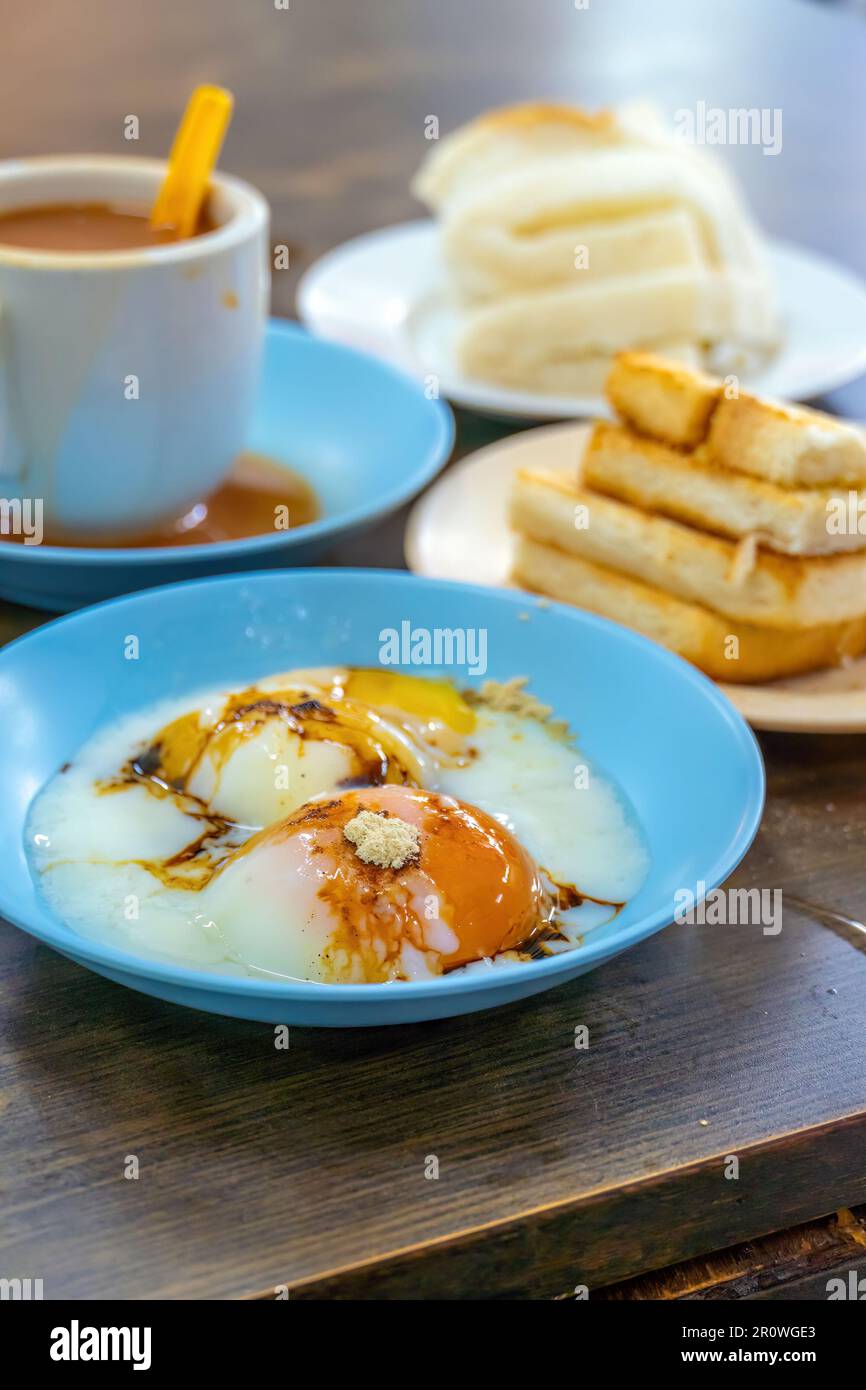 Traditional breakfast set and coffee, boiled eggs and toast, popular in ...