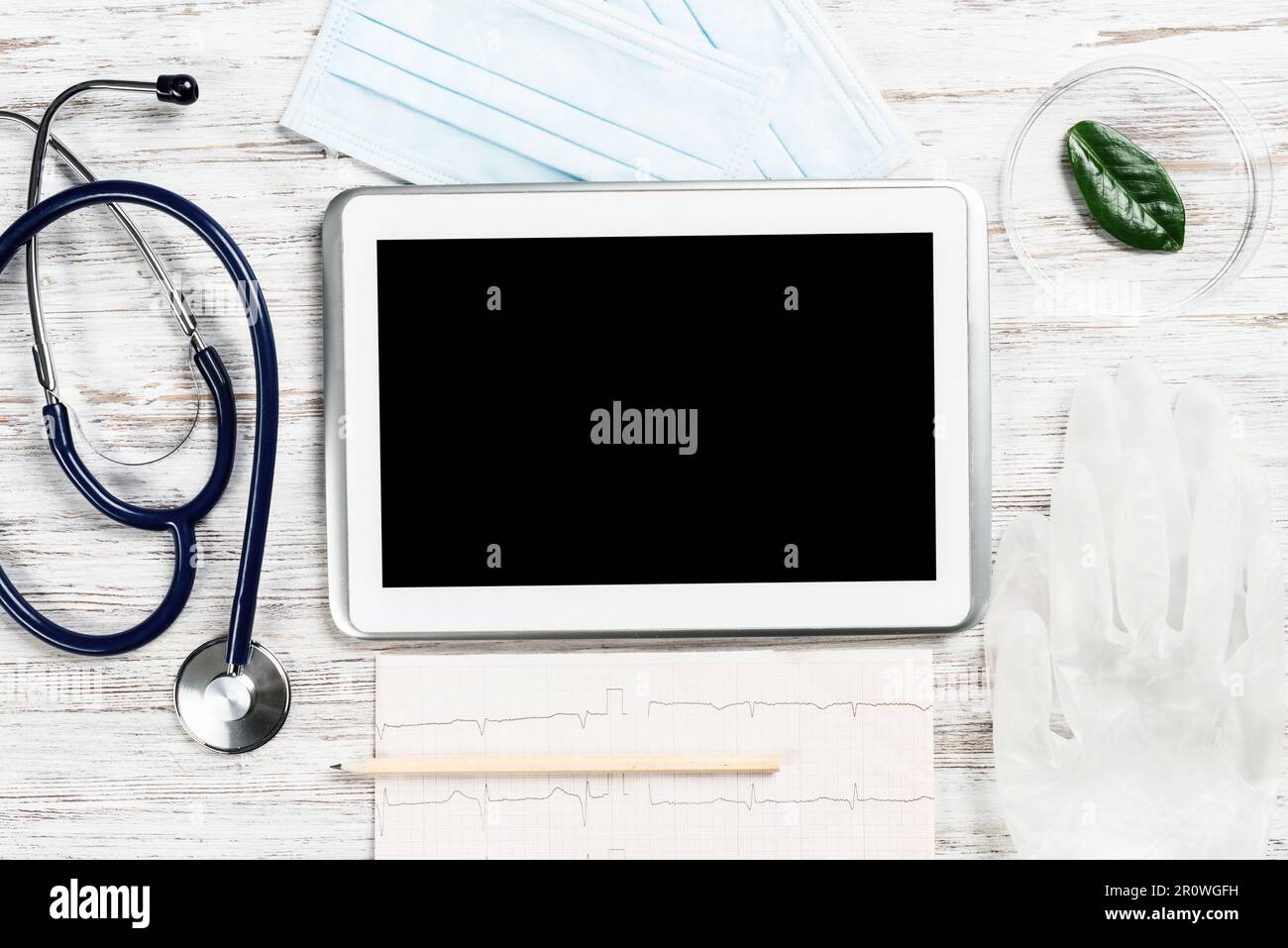 Mock up of doctors desktop with medical supplies Stock Photo - Alamy