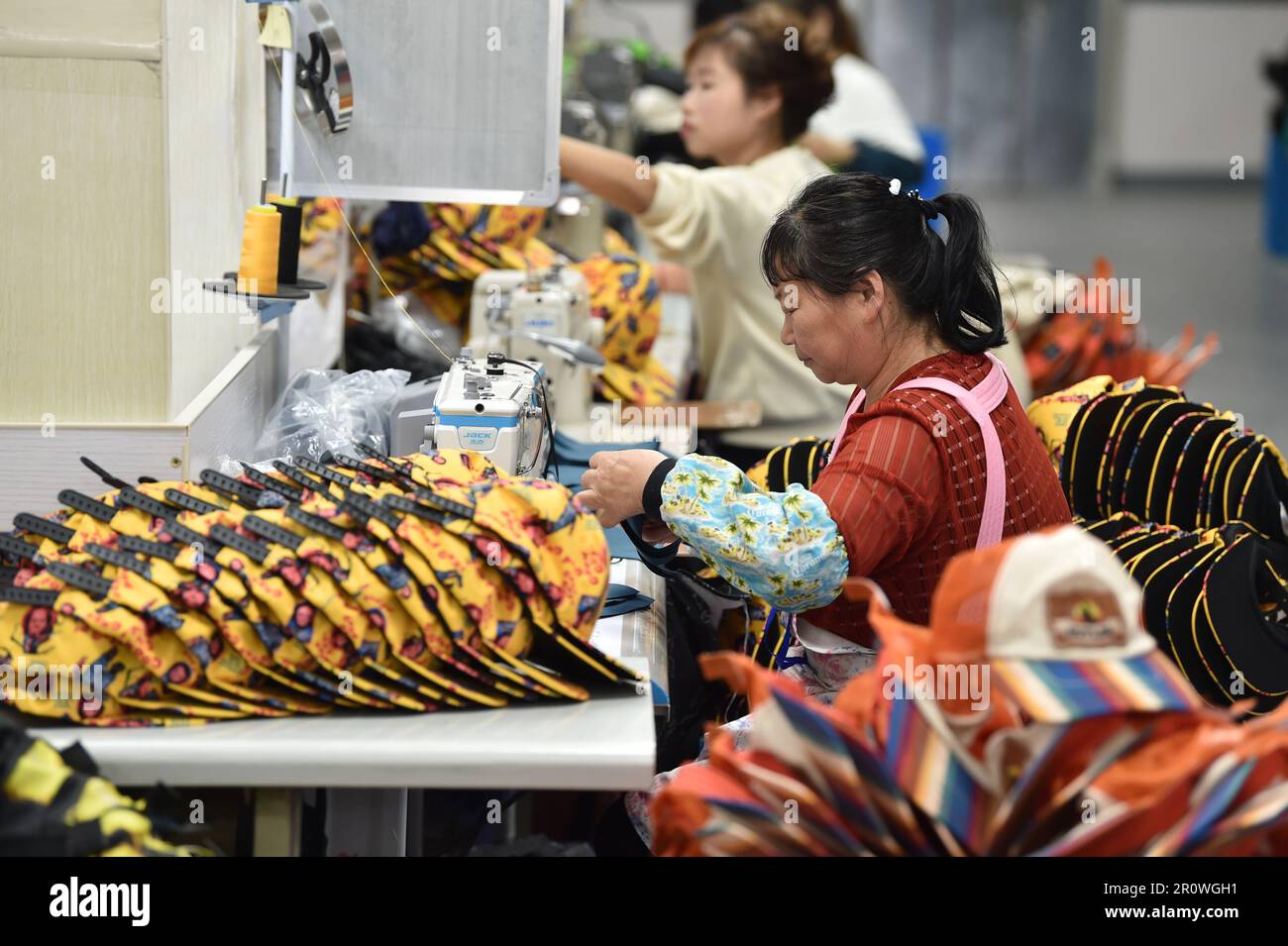 SUQIAN, CHINA - MAY 10, 2023 - Workers process hats for export at a ...