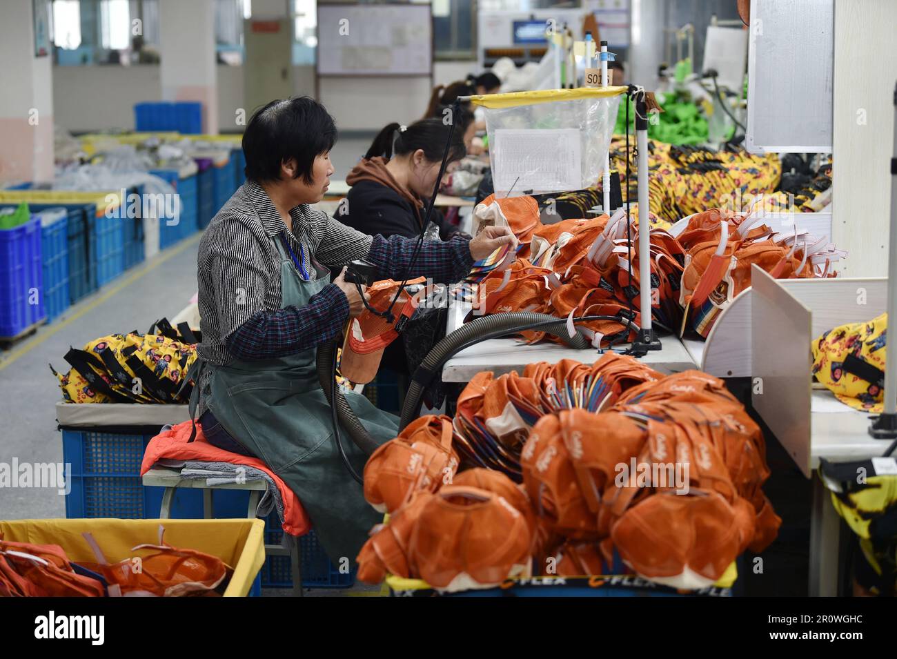 SUQIAN, CHINA - MAY 10, 2023 - Workers process hats for export at a ...
