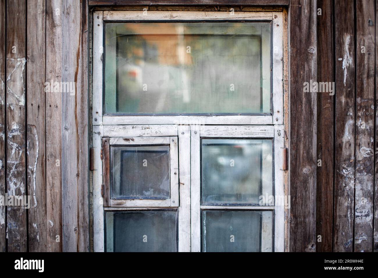 Old wooden two-storey houses with windows in the city of Tomsk, Russia ...