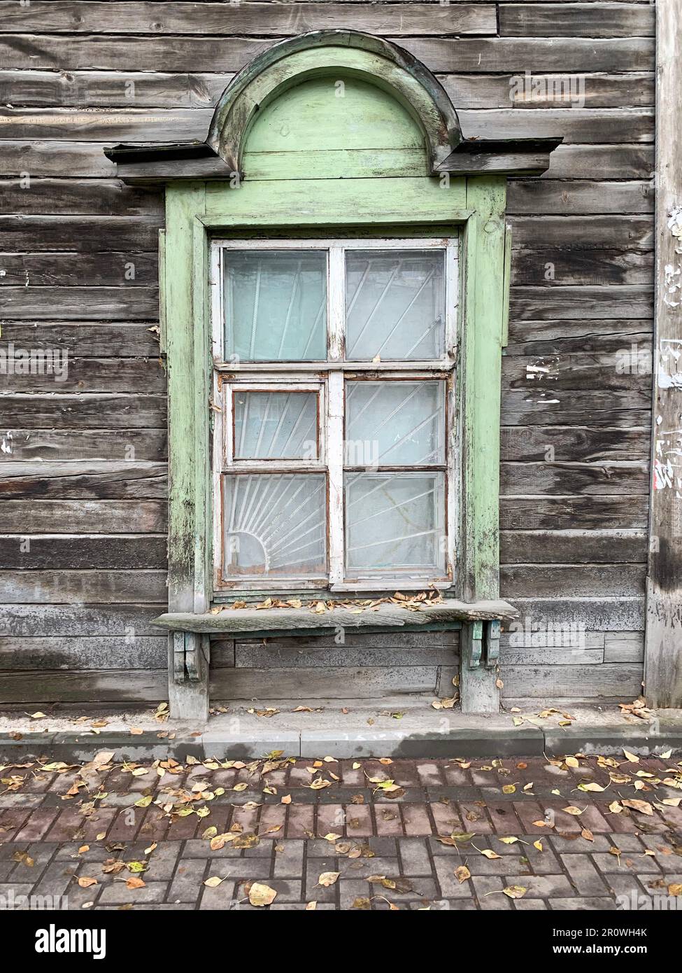 Old wooden two-storey houses with windows in the city of Tomsk, Russia ...