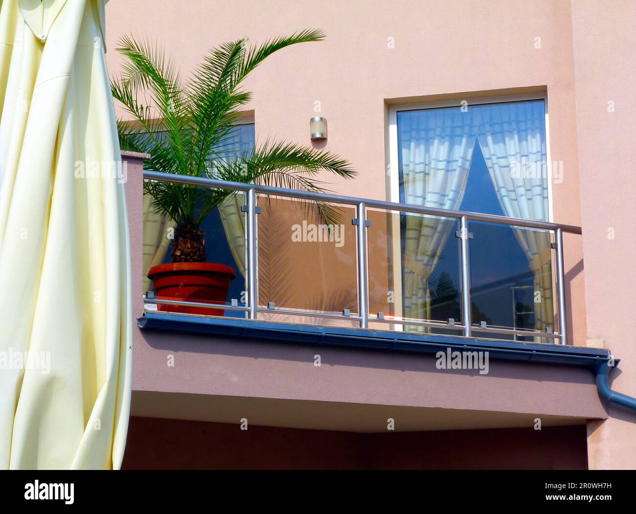 glass balustrade with small Mediterranean terrace and balcony. bright ...