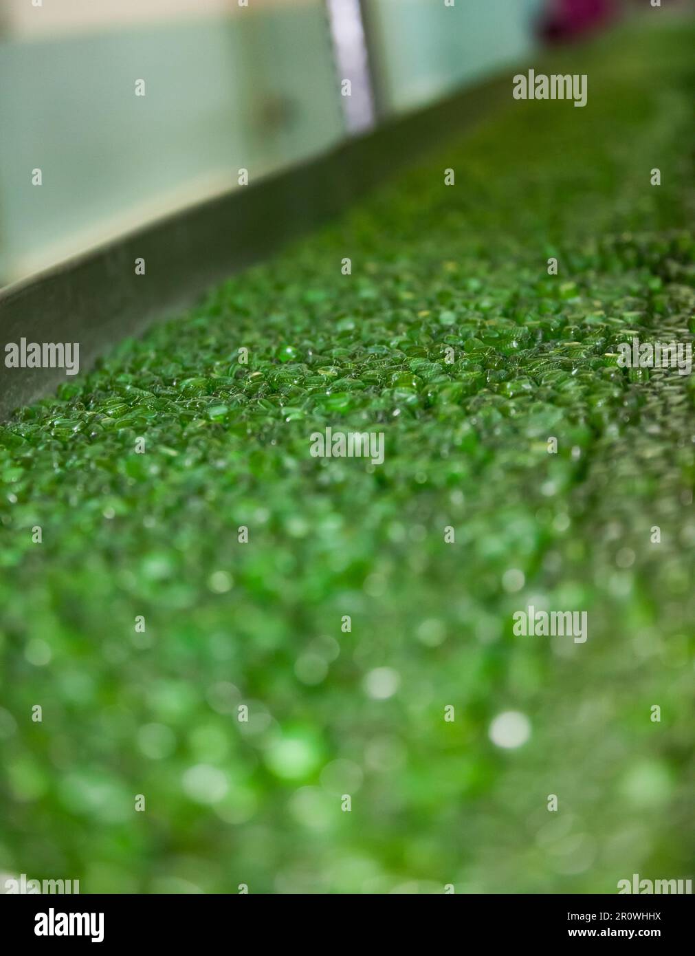 Caramel sweets on conveyor of confectionery factory. Macro photo, low ...
