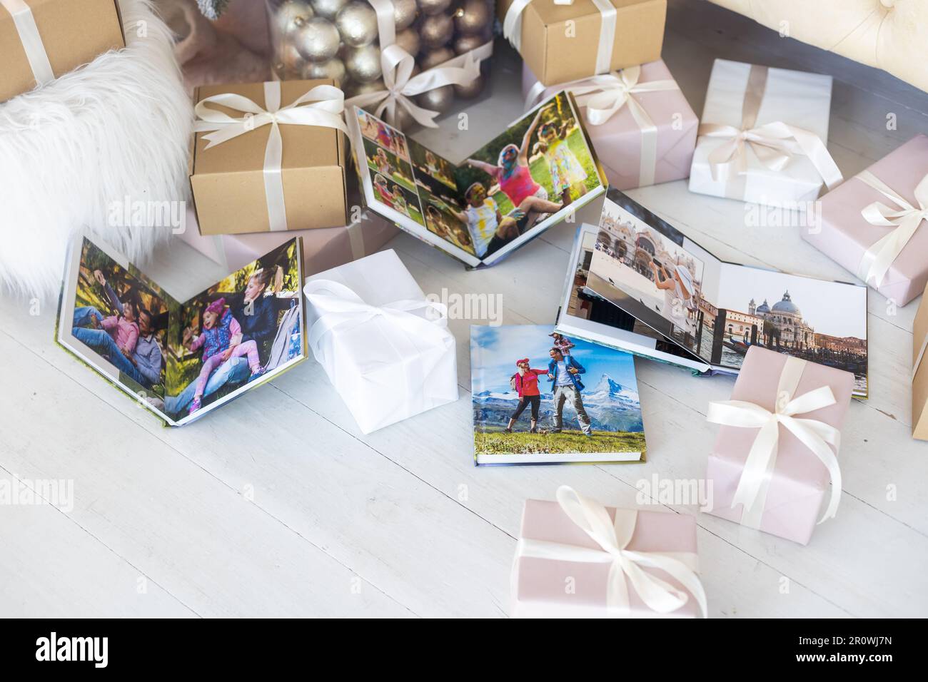 a Photobook of family.Photobook is gift. photo album next to gifts ...