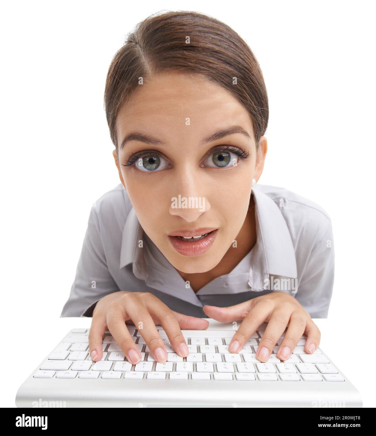Office eyes. Portrait of a young woman leaning against a keyboard ...