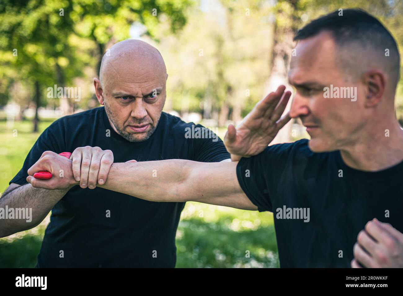 Knife attack self-defense. Techniques of disarming knife attacker. Weapon disarm training Stock ...