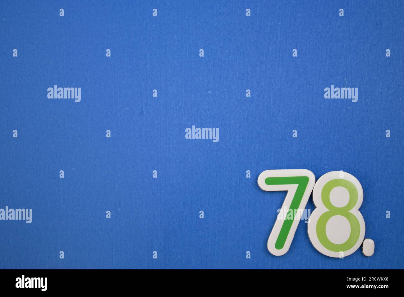 The number 78 in green color, photographed from above, placed on the ...