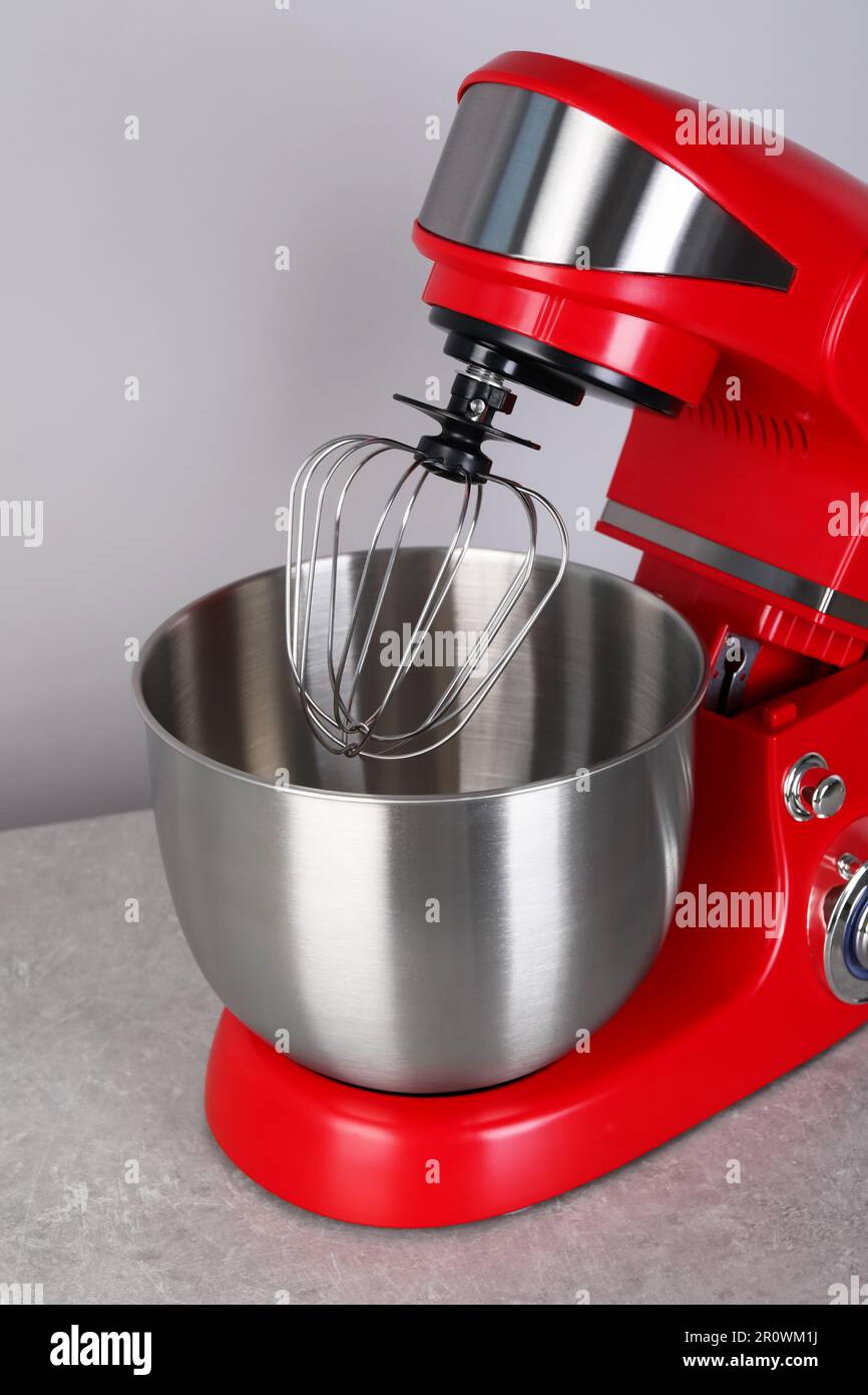 Modern red stand mixer on light gray table Stock Photo - Alamy
