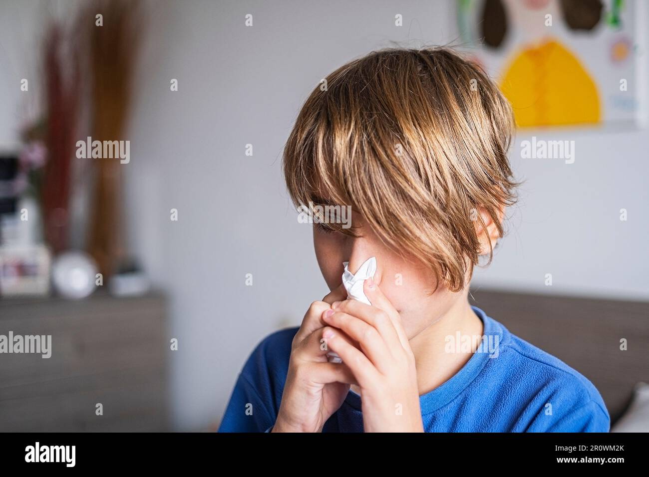 Child boy blow his nose. Allergic kid, flu season. Kid with cold ...