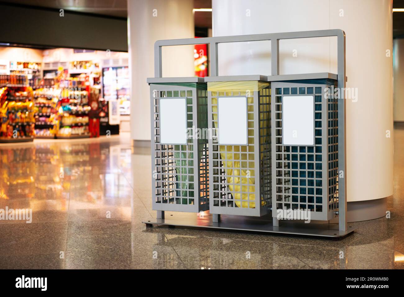 Sorting bins for waste recycling in shopping mall Stock Photo - Alamy