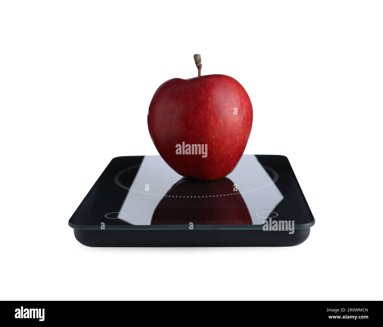Digital kitchen scale with ripe red apple on white background Stock ...