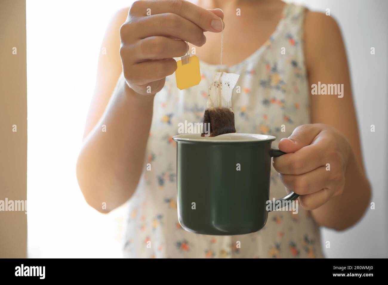 Woman hand teabag hi-res stock photography and images - Alamy
