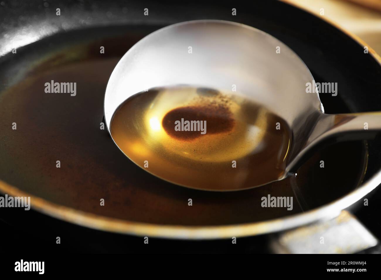 Used cooking oil ladle hi-res stock photography and images - Alamy