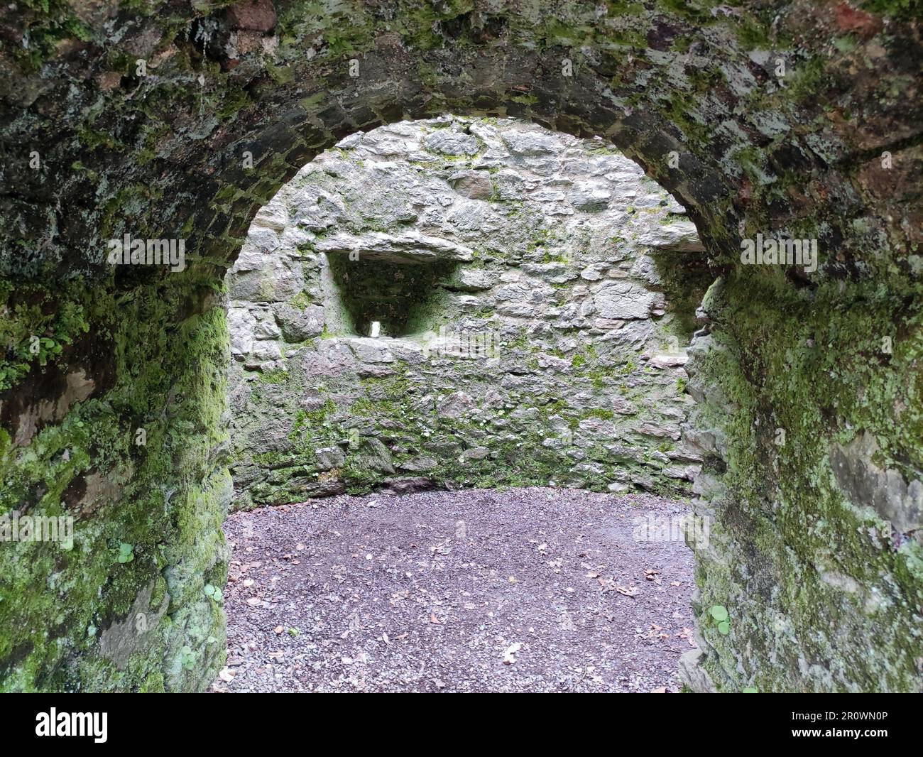 Stone arch of old celtic fortress, a Blarney castle in Ireland, rocks ...