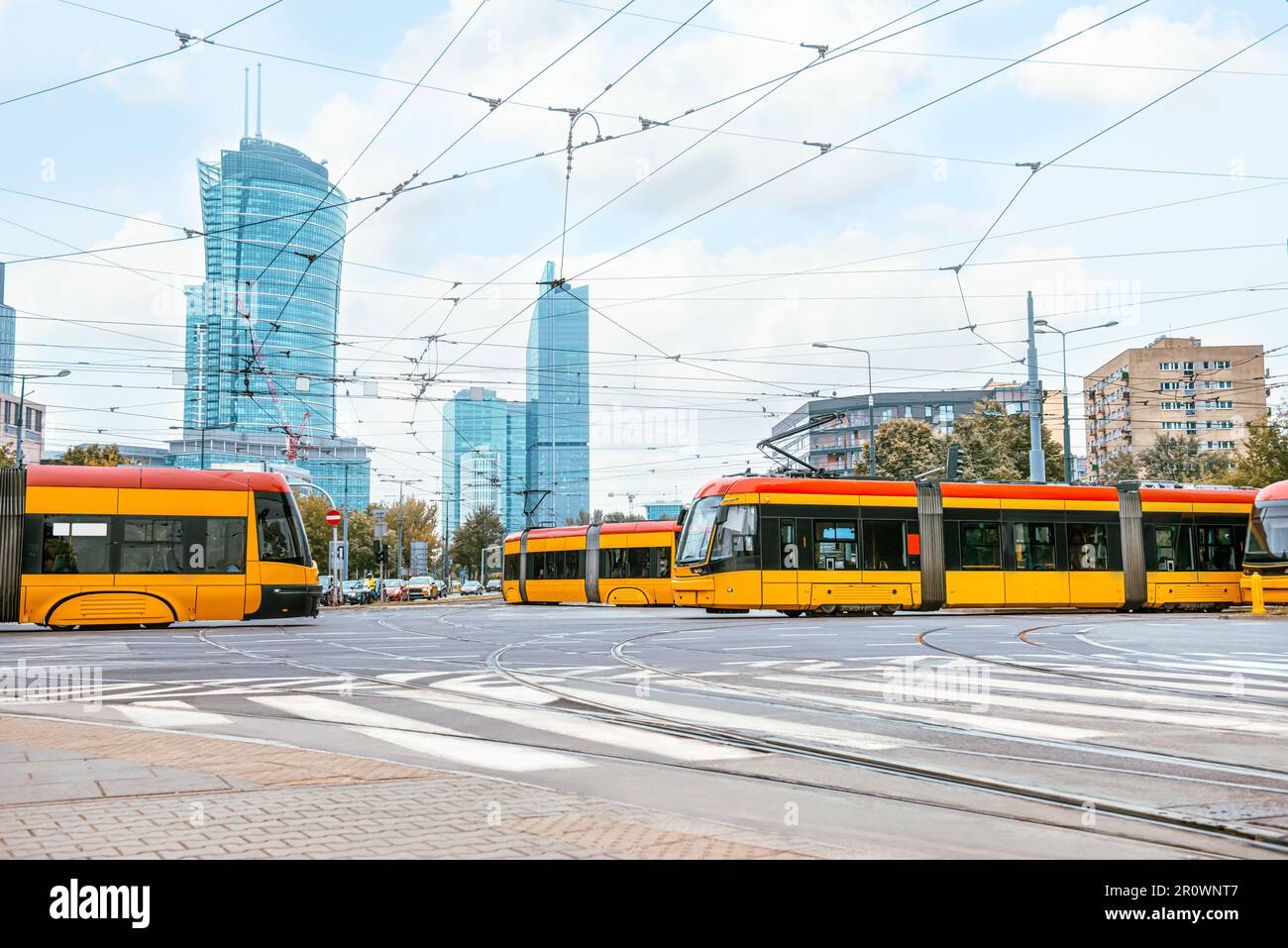 Modern trams on city street. Public transport Stock Photo - Alamy
