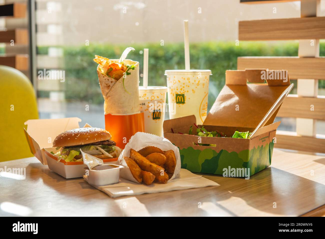 WARSAW, POLAND - SEPTEMBER 16, 2022: Big Mac hamburger, fried potatoes ...