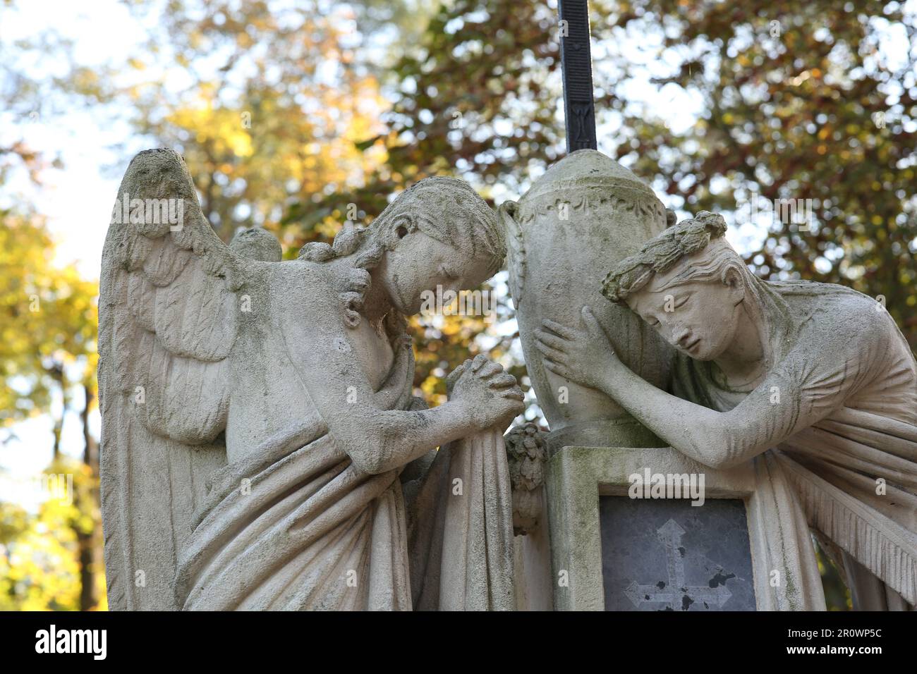 Beautiful statues of angels at cemetery. Religious symbol Stock Photo ...