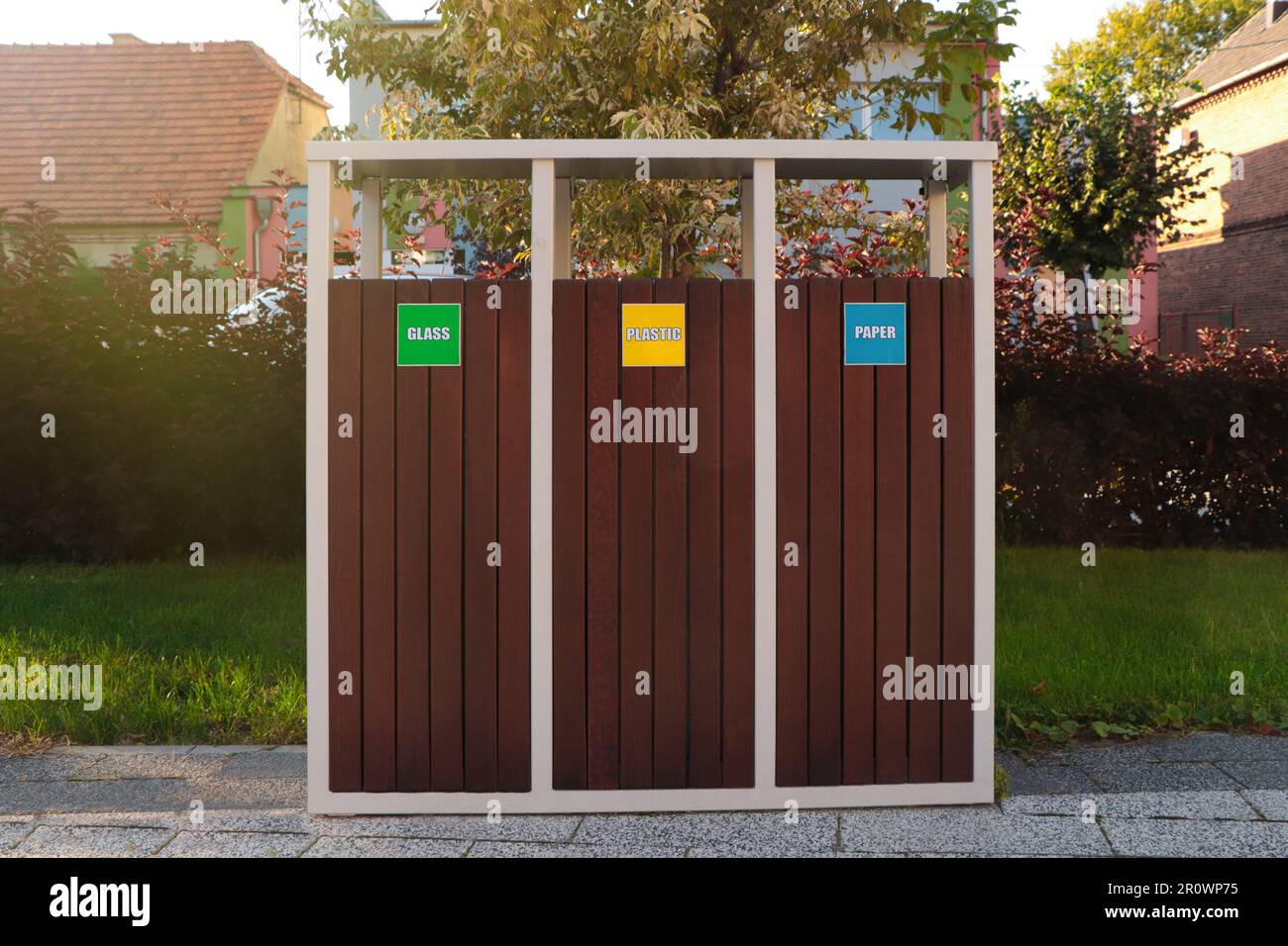 Different sorting bins for waste recycling on sunny day outdoors Stock ...