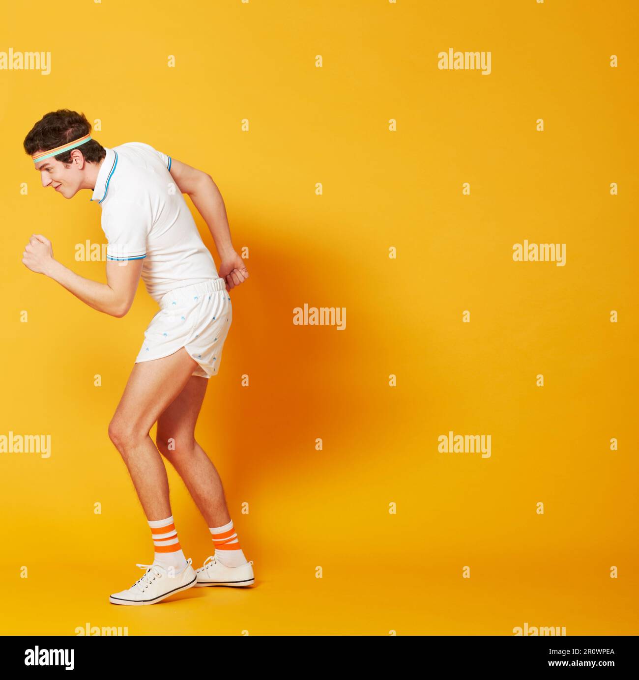 Fist, exercise and sports man isolated on yellow background in power ...