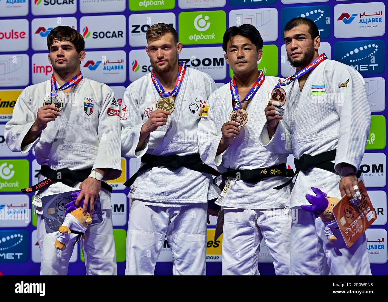 Doha, Hashimoto Soichi (2nd L) of Japan and Murodjon Yuldoshev of ...
