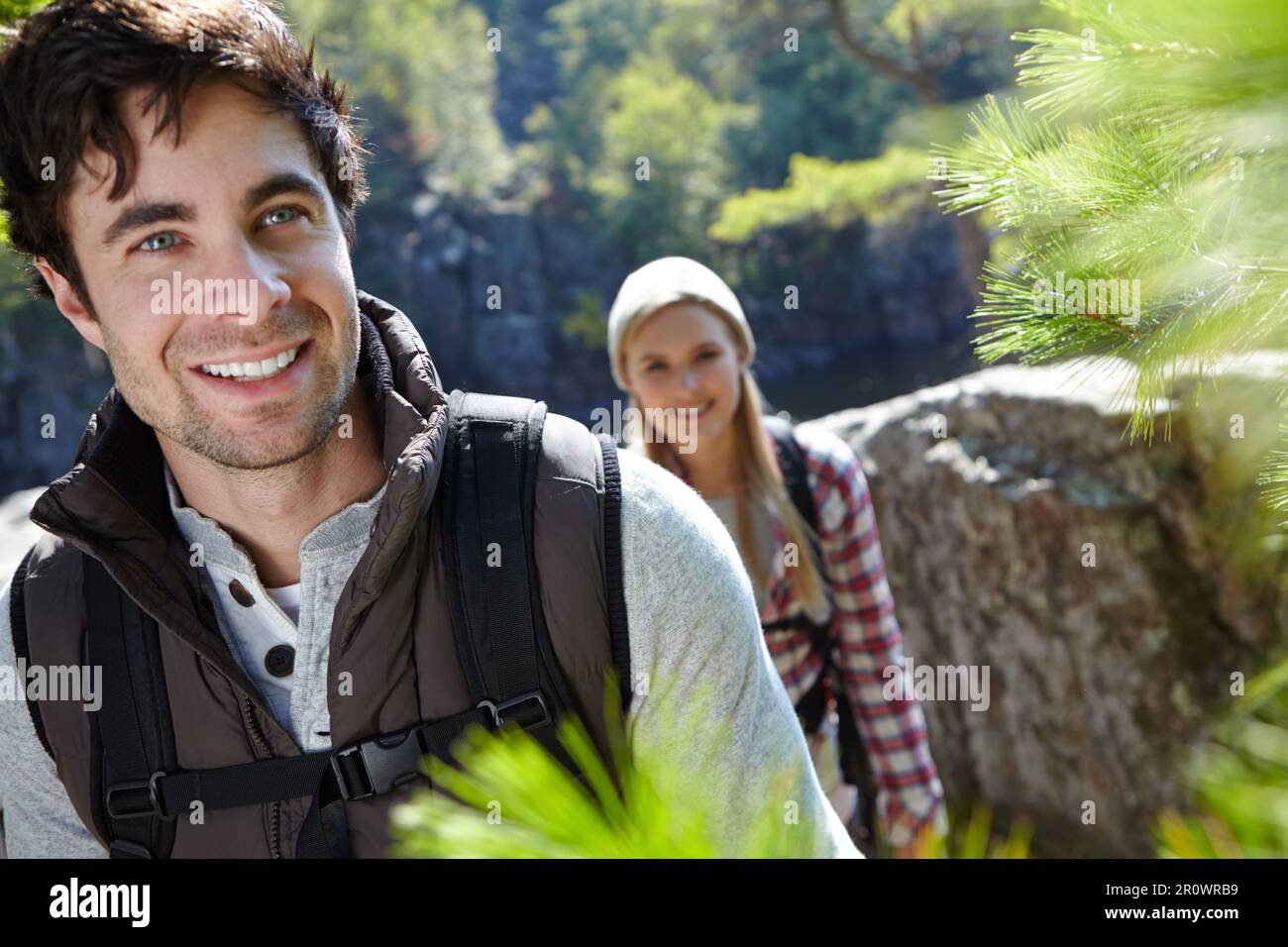 Enjoying a relaxing day in the woods. A young couple exploring nature ...