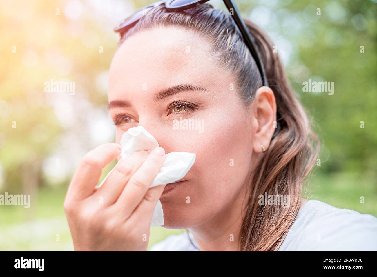 Young woman suffering from allergy outdoors. Pollen allergy symptoms Stock Photo - Alamy