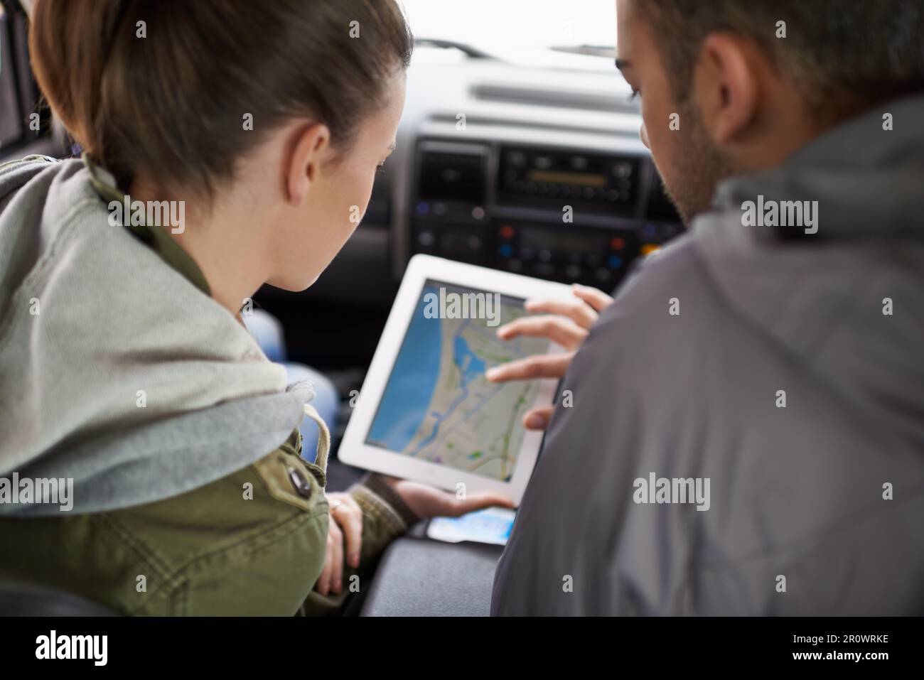 Young couple tablet checking map hi-res stock photography and images ...