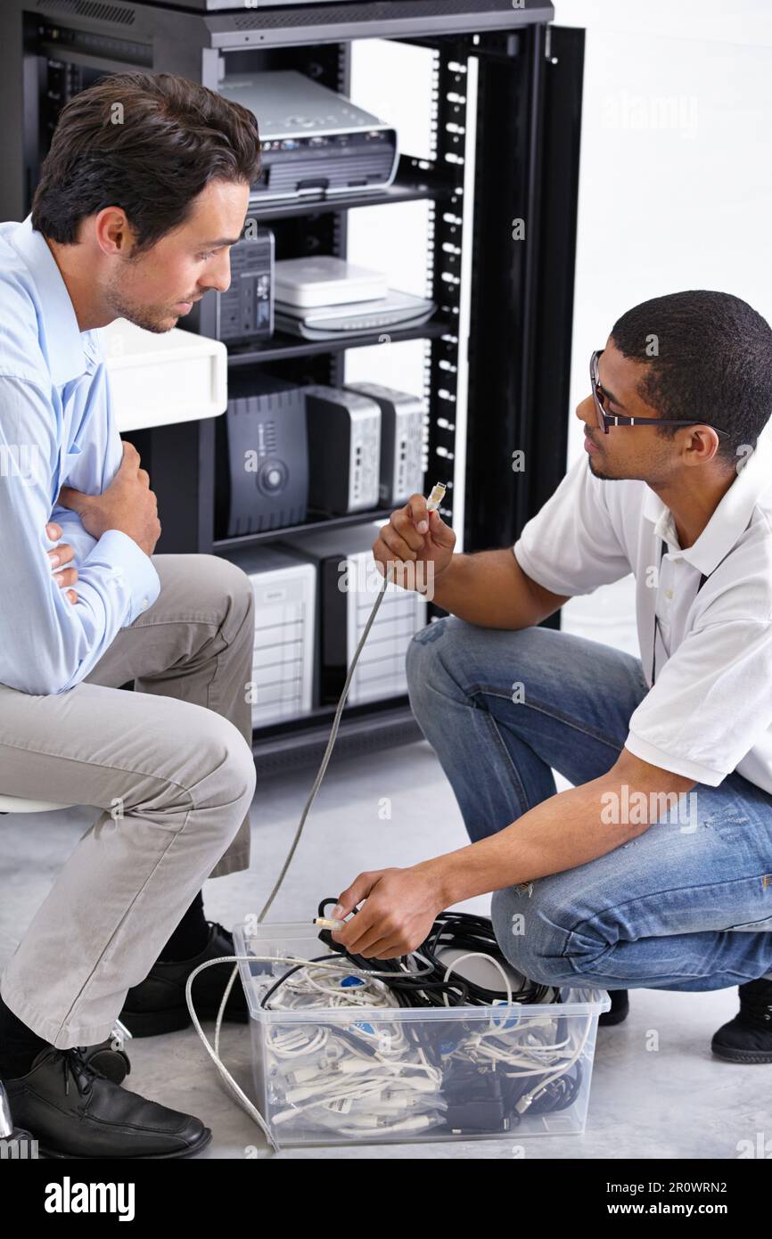 Server room, it support and network with a technician talking to a ...
