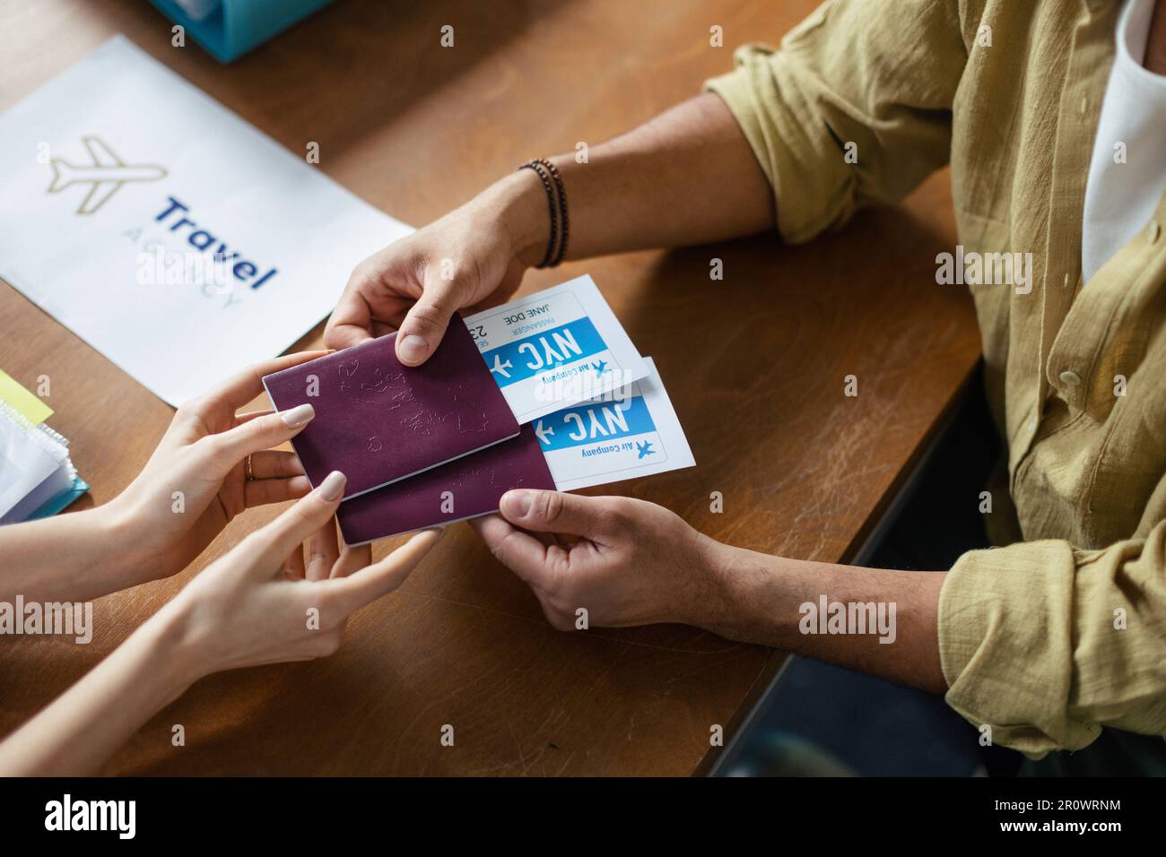Top view of plane tickets in travel agency Stock Photo - Alamy