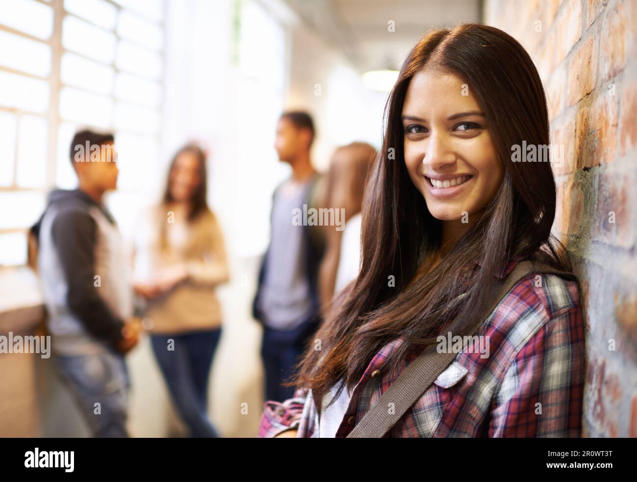 Learning, smile and portrait of woman in college hallway for studying ...