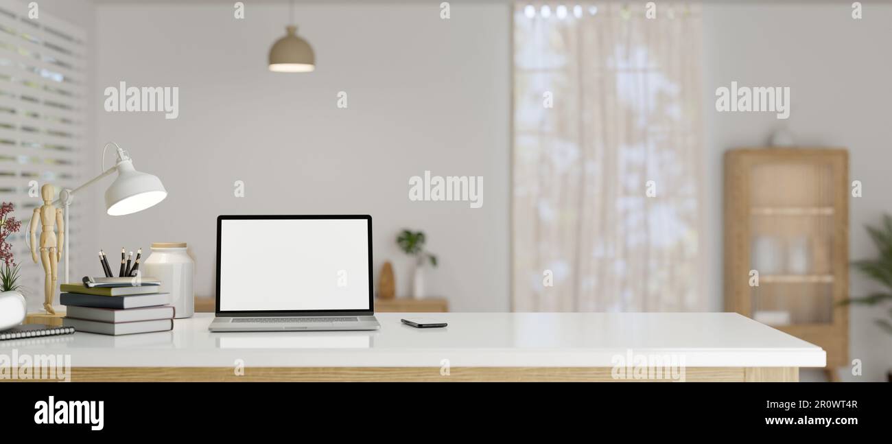 A study table in a minimal Scandinavian room with laptop computer white ...