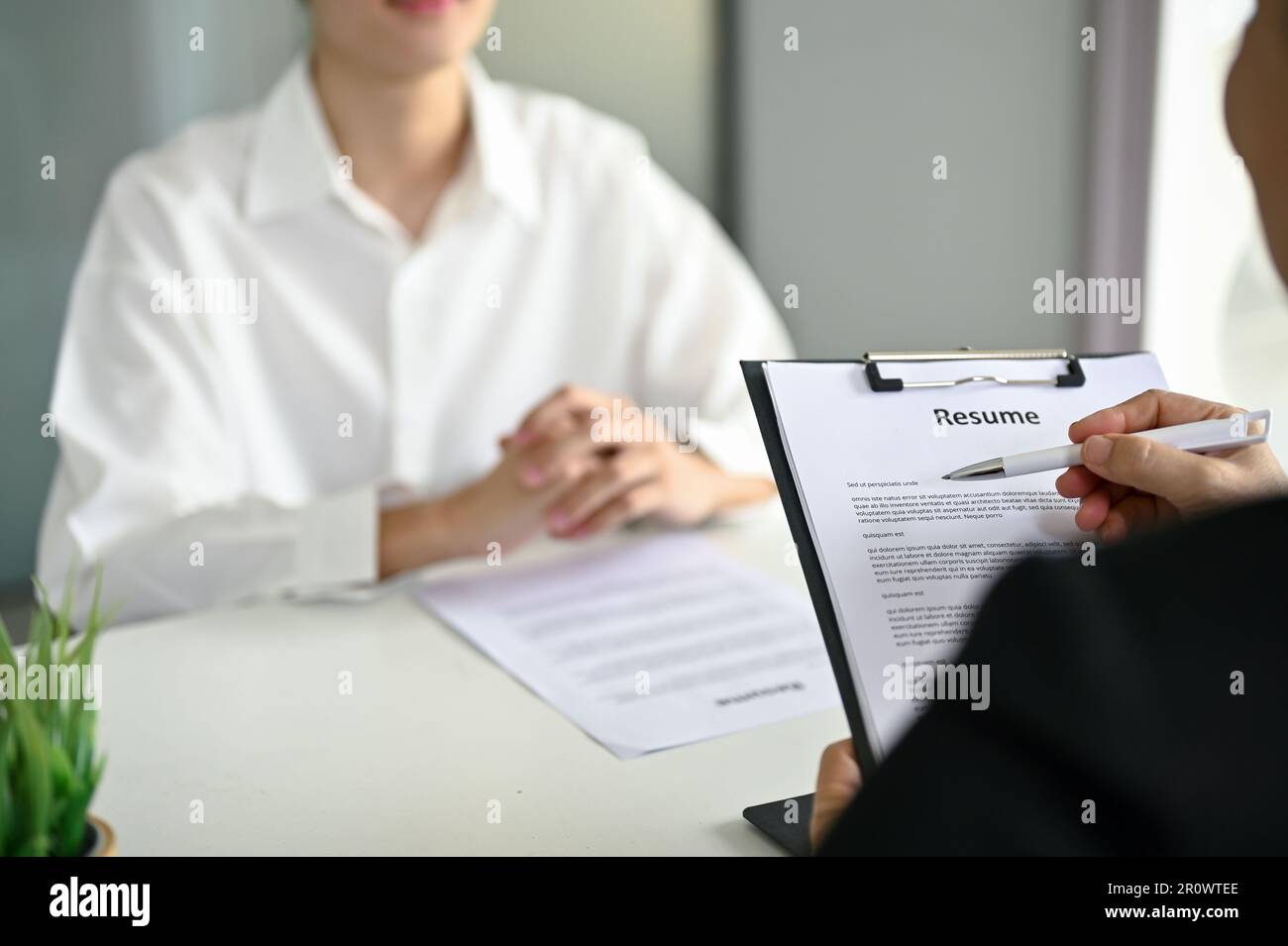 Close-up image of a professional recruiter or HR manager reading a ...
