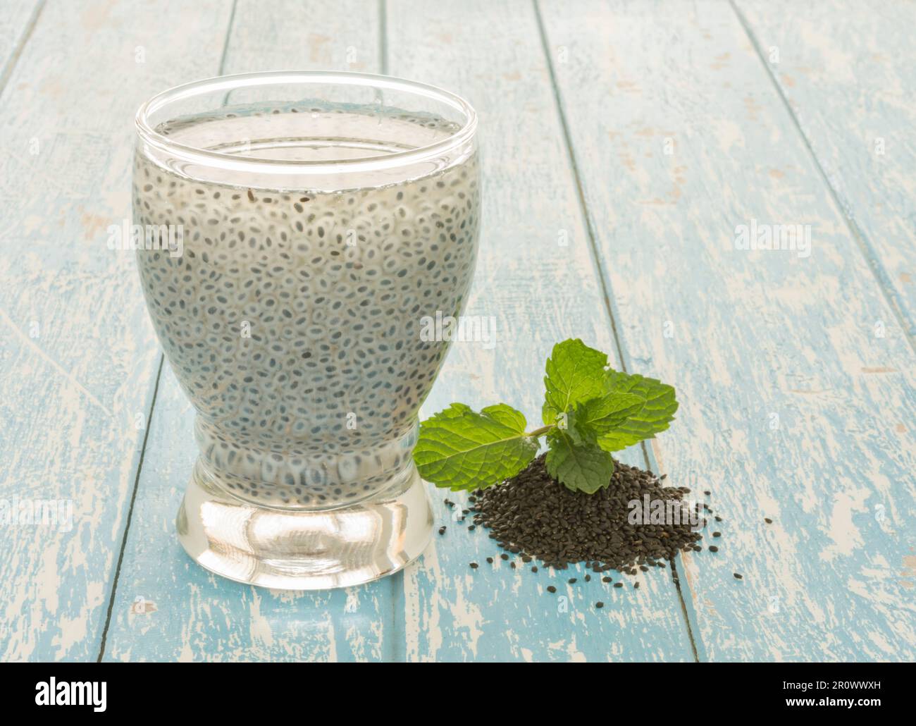 Sweet basil seed drink in glass of water on woodden background Stock ...