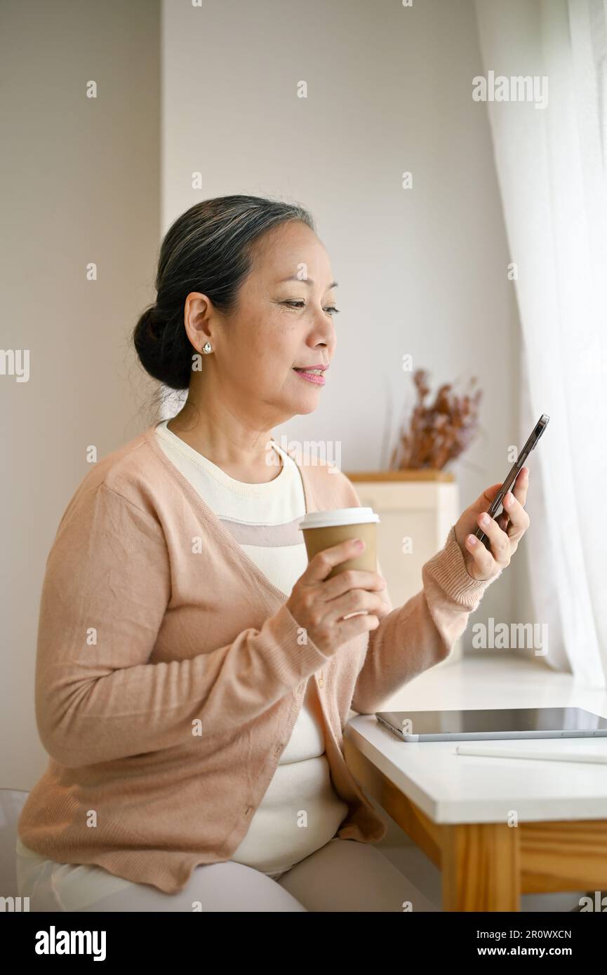 Asian woman mature cafe hi-res stock photography and images - Alamy