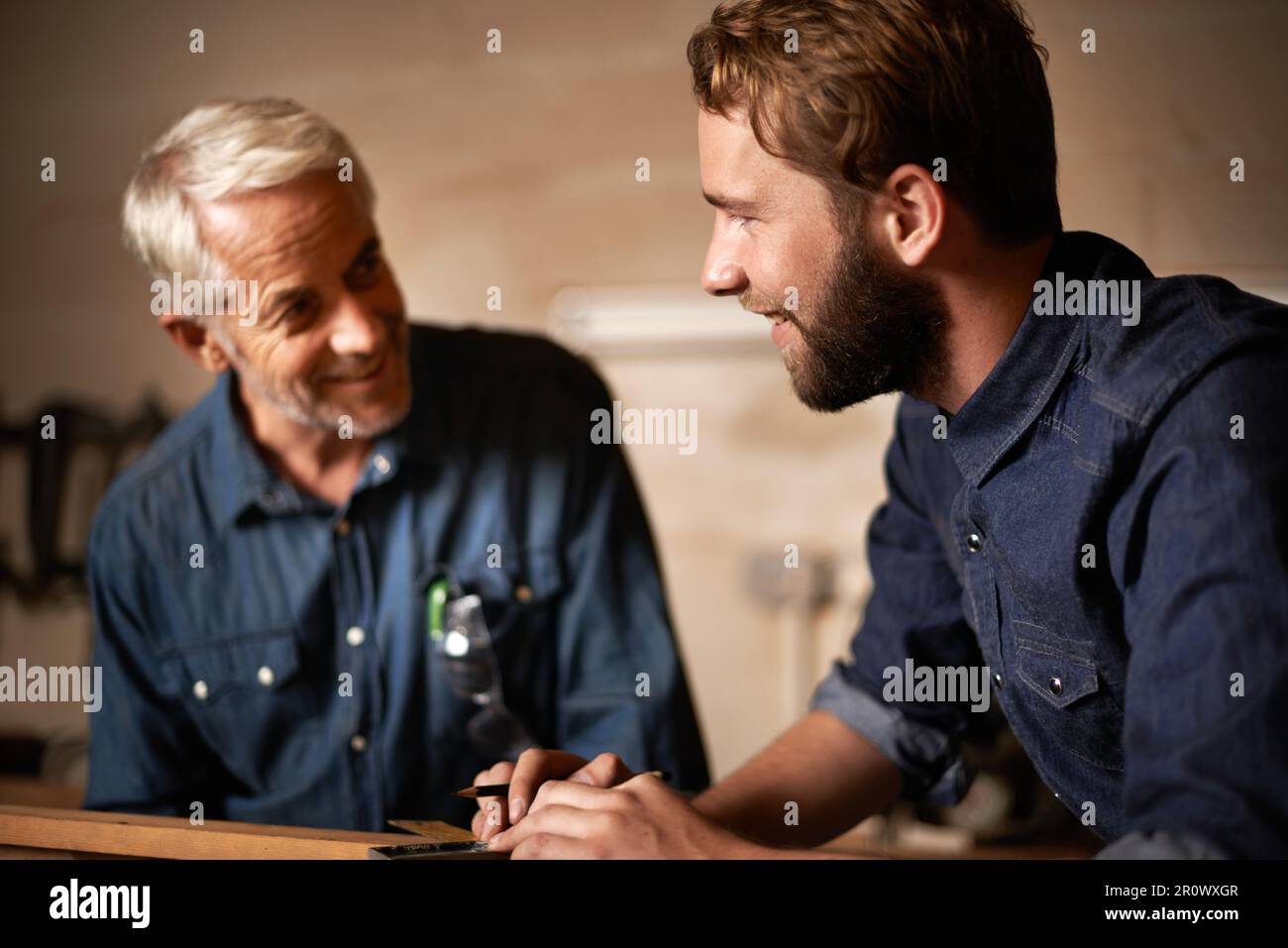 Imagination takes you everywhere. a father and son working on a ...